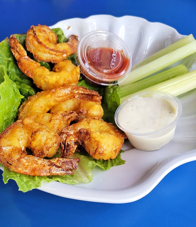 These golden-fried shrimp aren't just cooked—they're pampered. Crispy outside, tender inside, they're the beauty queens of the seafood pageant.