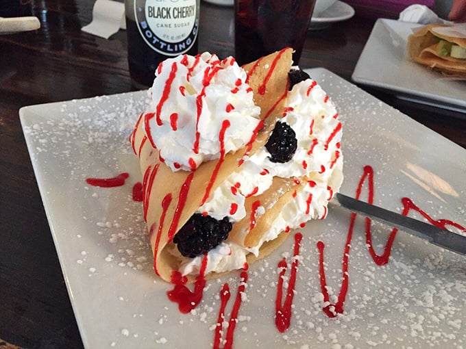 Whipped cream mountains, berry treasures, and powdered sugar snow—this dessert landscape is worth the expedition.