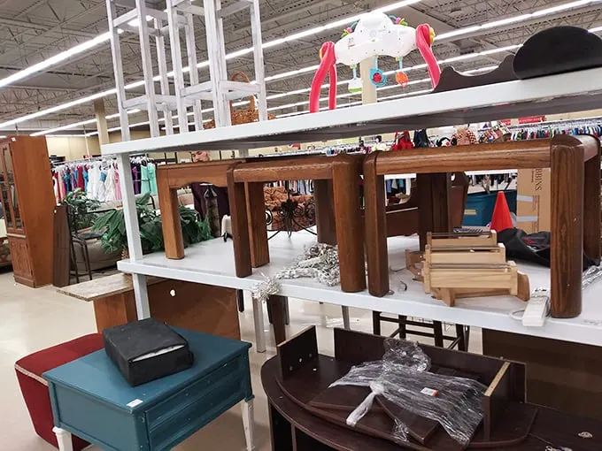 Tables and shelves in various states of dignity, waiting for someone to see past the scratches to possibility.