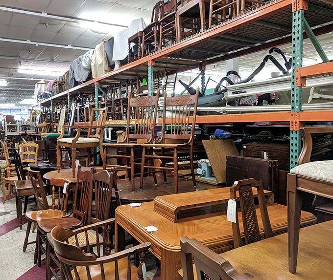 Wooden chairs stacked like a game of furniture Jenga. Each one with its own character and history, ready to become the "where did you get that?" piece in your dining room.
