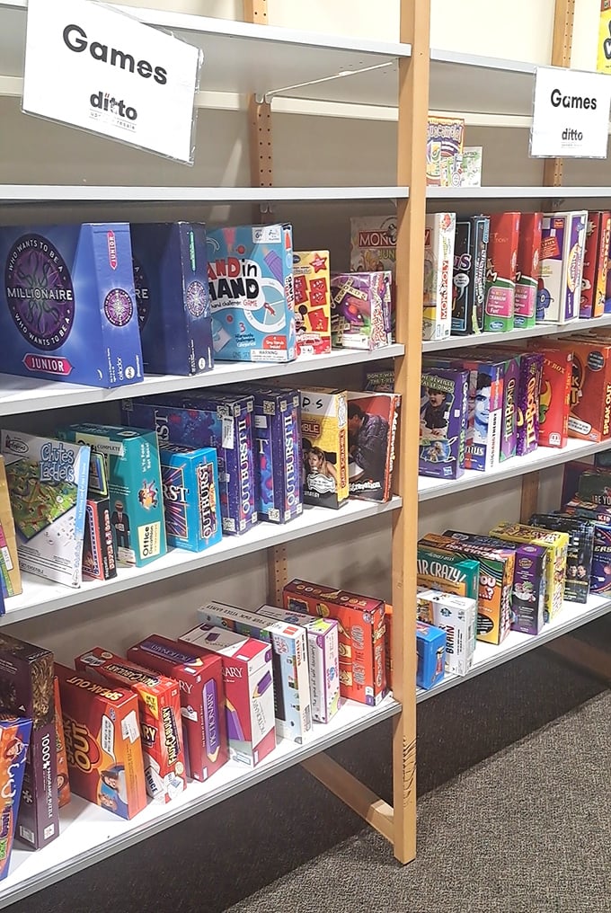 Board game shelves packed with entertainment possibilities—each box a portal to family game nights of yesteryear.