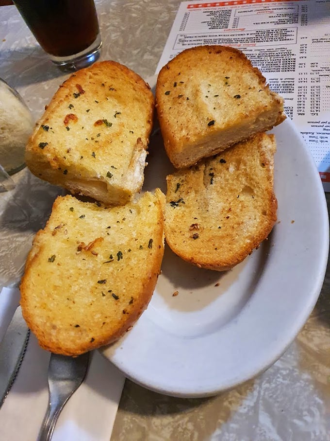 Garlic bread that doesn't whisper its presence—it announces itself with golden, buttery authority and enough garlic to keep vampires at bay for centuries.
