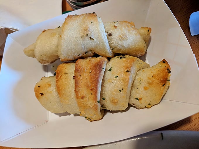 Garlic knots that look like they've been working out—plump, golden, and ready to be the unsung heroes of your meal.