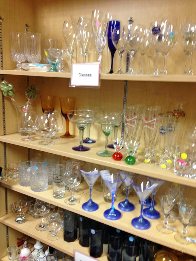 A rainbow of glassware awaits new homes. That cobalt blue stemware might be the conversation piece your bar cart needs.