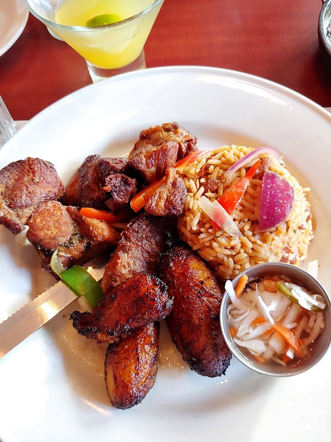Griyot – Haiti's gift to your taste buds. These crispy pork morsels with colorful rice could make even the most dedicated health nut temporarily abandon their principles.