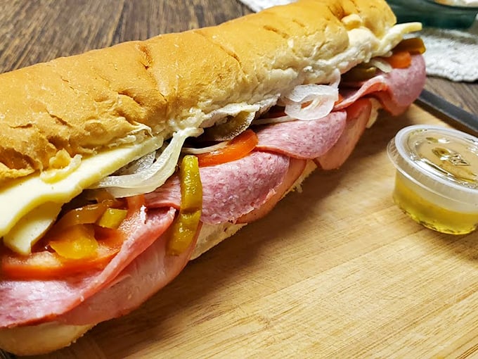 This Italian hoagie is architectural perfection—layers of meat, cheese, and vegetables creating a handheld masterpiece that puts modern "artisanal" sandwiches to shame.