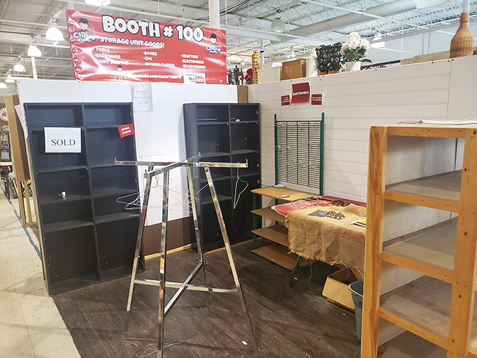 Booth #100 advertising "storage units galore" reveals the secret source of many flea market treasures—someone else's storage regrets.