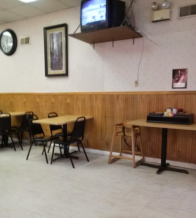 Simple wooden tables and chairs—not designed for lingering, but for focusing on the serious business of sandwich appreciation.