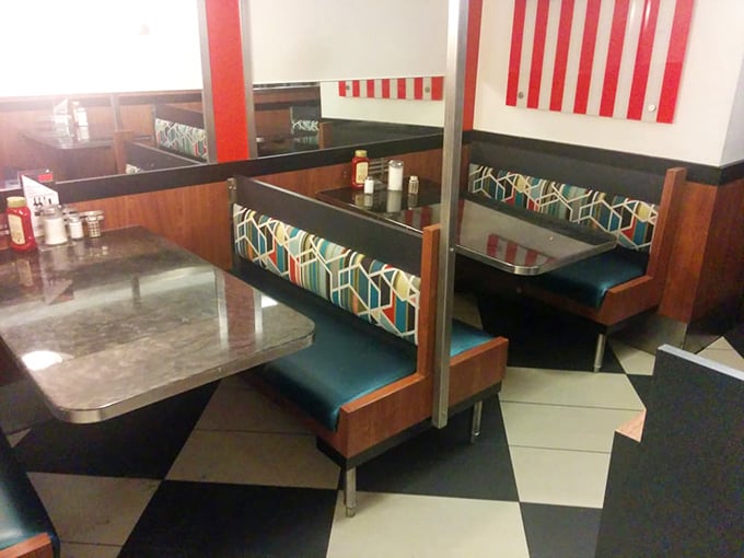 Classic diner booths where countless life decisions have been made, relationships ended, and breakfast-for-dinner debates settled once and for all.