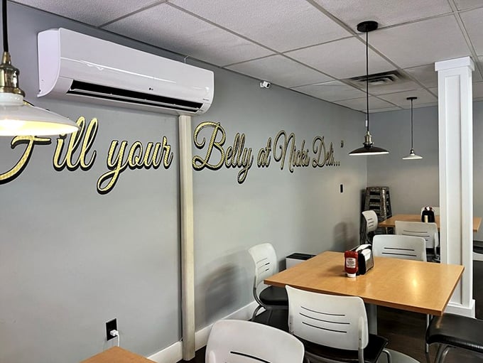 That elegant gold script on the wall isn't just decoration—it's truth in advertising. The minimalist dining area lets you focus on what matters.