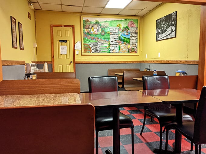 Simple, honest dining room where the focus stays where it should be—on the food. The mural adds a touch of old-country charm.
