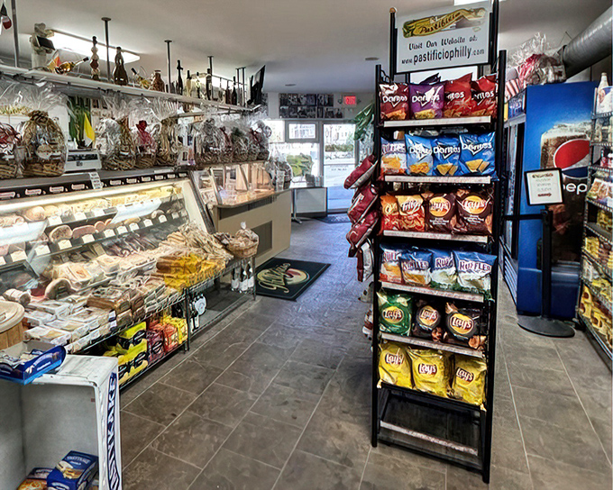 The deli case and chip display—a supporting cast that deserves its own spin-off. Italian market essentials within arm's reach.