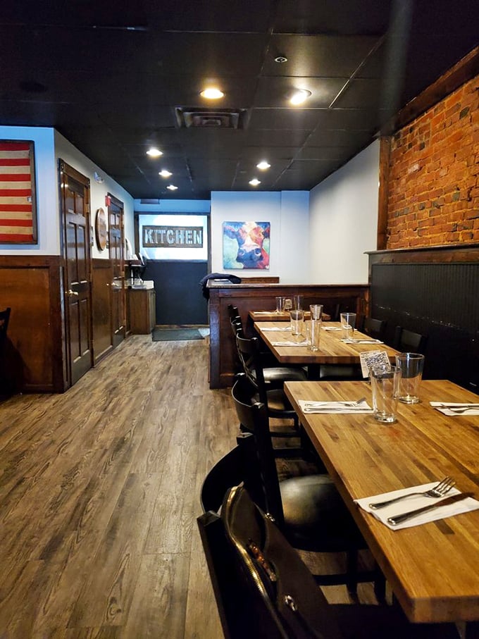 Wooden tables, brick walls, and an American flag create a dining room that feels like the best kind of homecoming—one where someone else does the cooking.