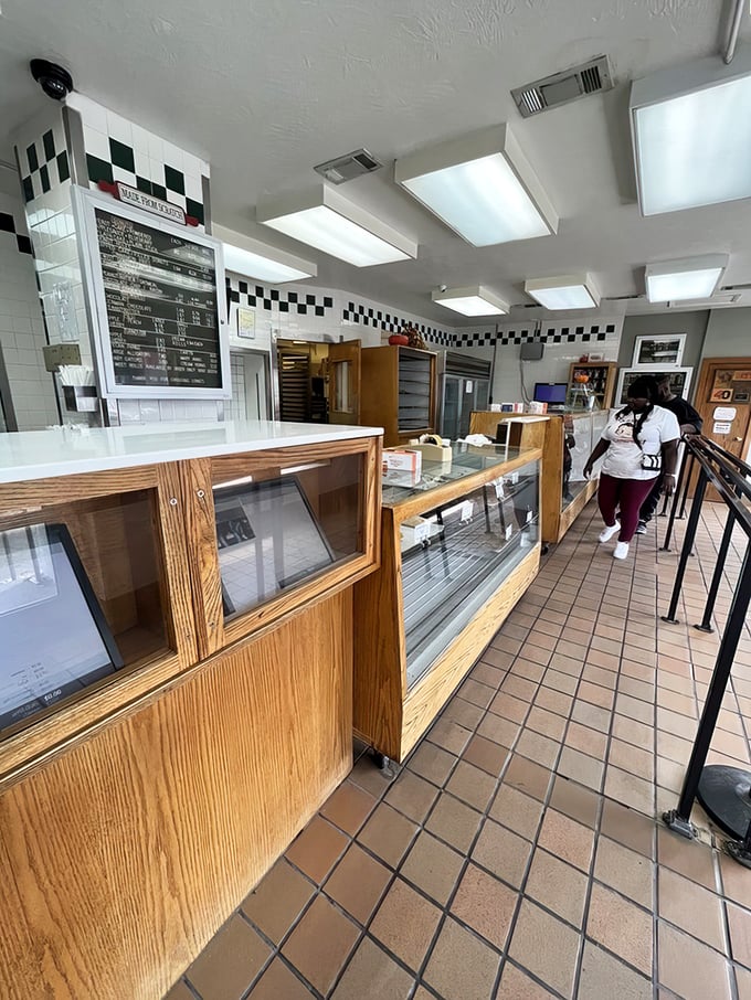 No-frills wooden display cases house treasures more valuable than gold. The checkered border adds that classic diner touch we all secretly love.