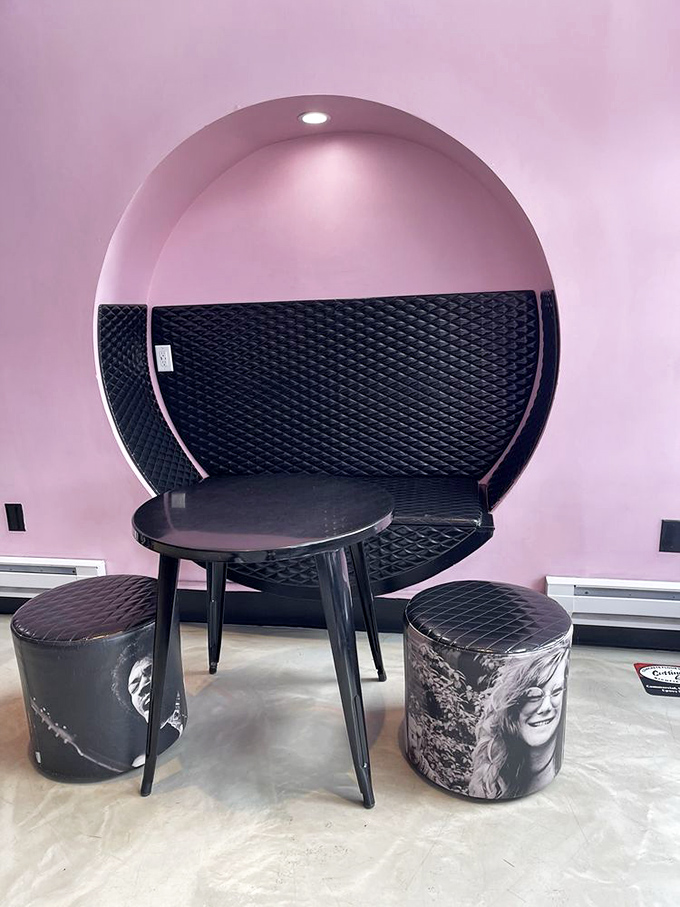 The circular booth creates a pink cloud sanctuary where music legends might have plotted their next albums—if they'd lived to enjoy good coffee.