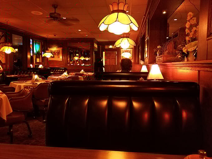 The dining room's leather booths and vintage lighting fixtures aren't retro—they're timeless, like the perfect Manhattan or a well-aged ribeye.