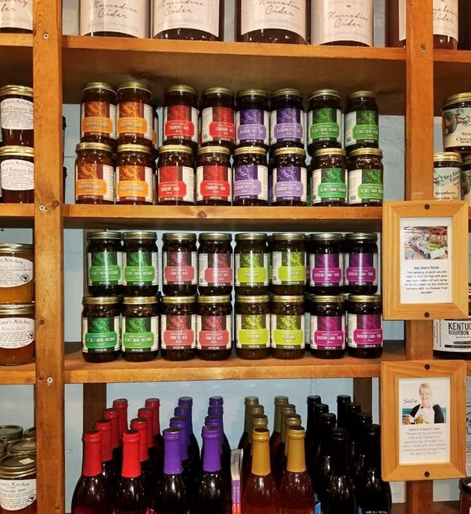 A rainbow of preserves standing at attention like delicious soldiers, each jar containing a different fruit's finest moment captured in time.
