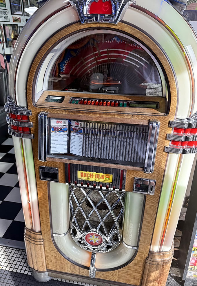 The vintage jukebox stands ready to provide your meal's soundtrack—five songs for a dollar and suddenly you're the DJ of your own dining experience.