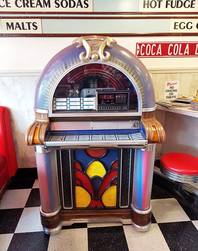 The vintage jukebox doesn't just play songs—it resurrects decades. One quarter and suddenly you're dancing the twist between bites of pie.
