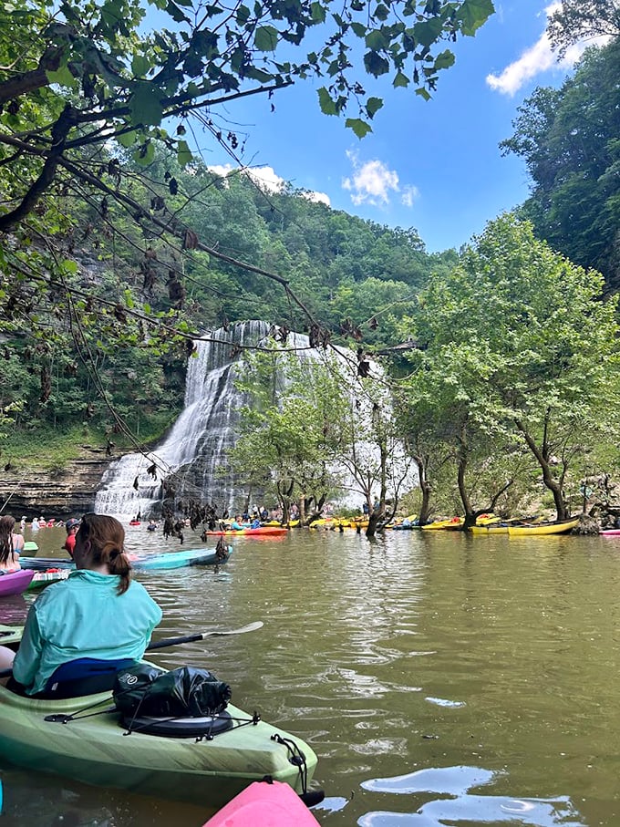 Kayakers gather at the base of the falls, proving that some people aren't content just looking at natural wonders – they need to paddle right up to them.