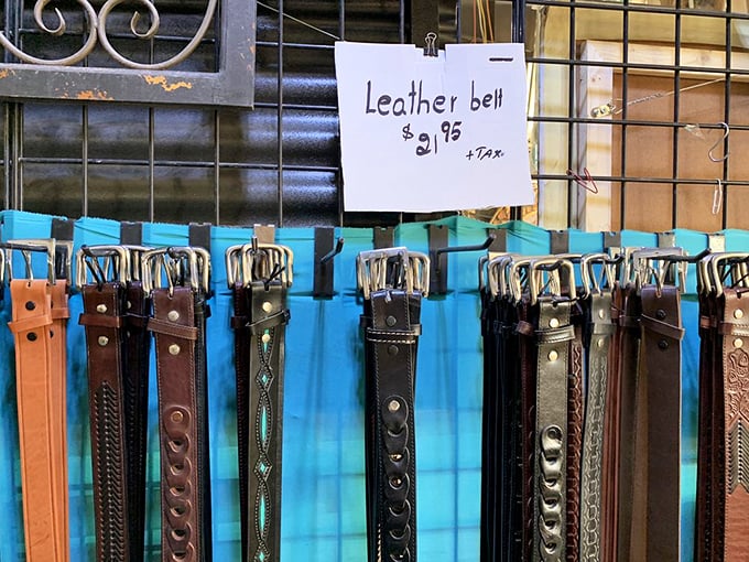 Leather belts hang like patient sentinels waiting for their perfect match. At these prices, your pants will never droop in public again.