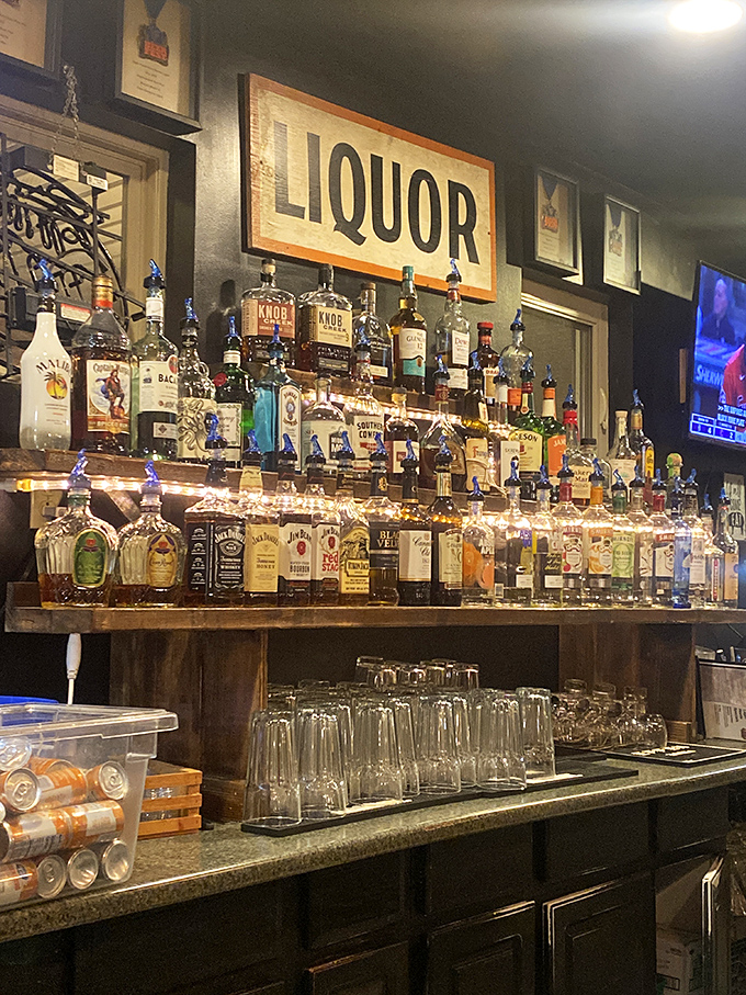 The liquor wall stands ready like a well-armed battalion prepared to combat the effects of meat sweats.