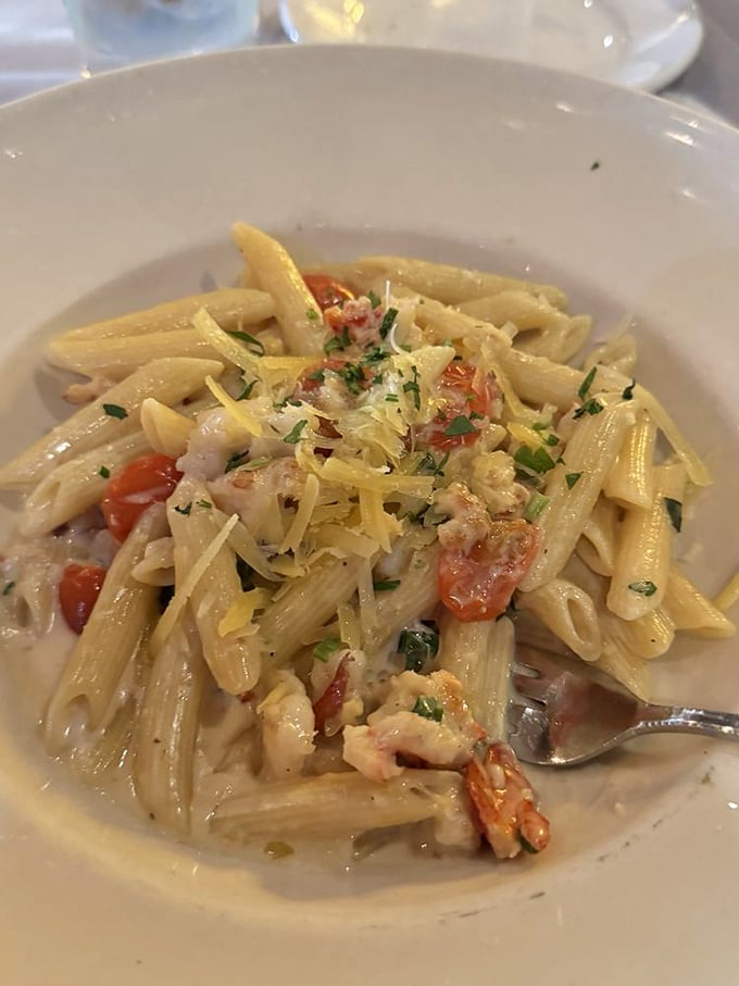 Pasta that's dressed better than most people at the Oscars – tender penne embracing shrimp and cherry tomatoes in a sauce that deserves its own fan club.
