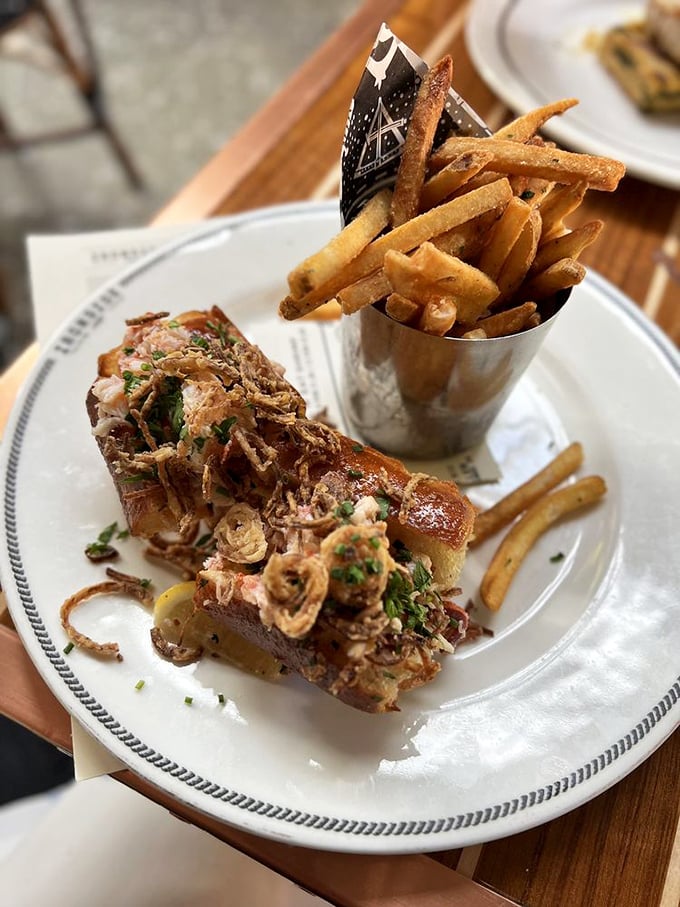 The lobster roll—where Maine tradition meets California sunshine. Those crispy bits on top? That's what dreams are made of.