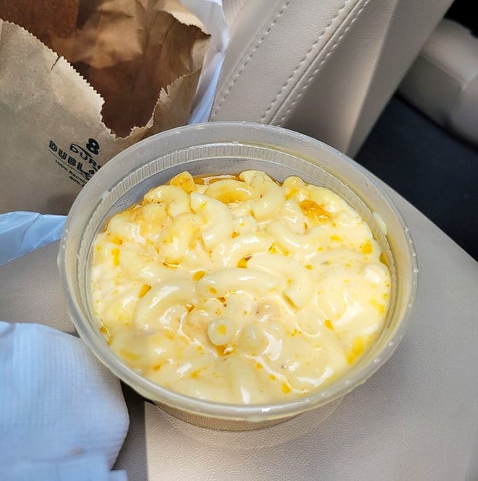 Creamy mac and cheese that's clearly not from a box – comfort in a container that begs to be savored.