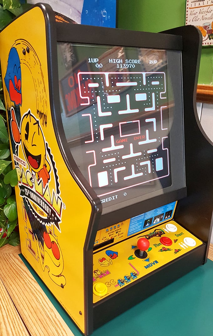 The vintage Pac-Man cabinet isn't just nostalgic decoration – it's where kids wait while parents order and where adults pretend they're waiting for kids.