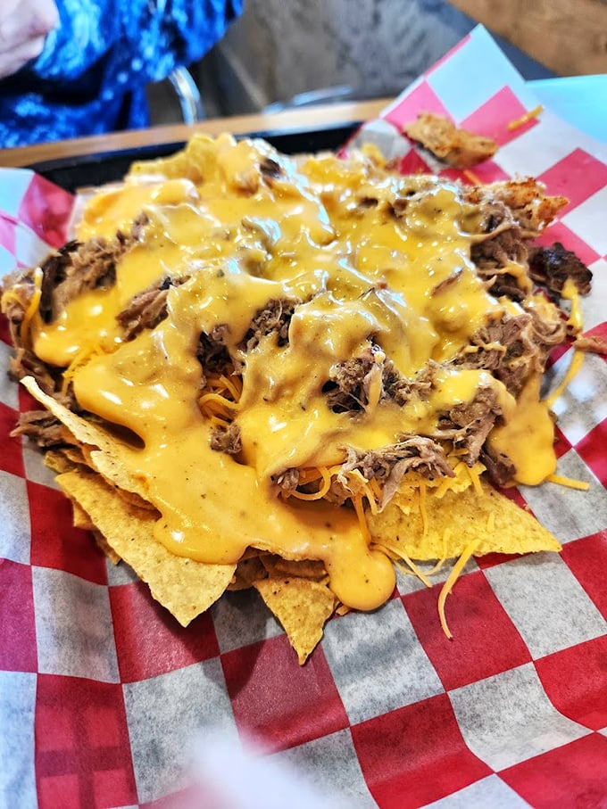Nachos that don't mess around—loaded with meat and cheese in quantities that would make a cardiologist wince but your soul sing.