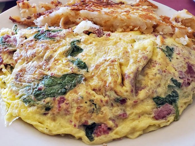 This omelet contains more fillings than your average novel has plot twists. The hash browns aren't just crispy—they're life-affirming.