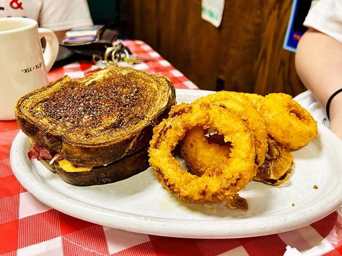Crispy, golden onion rings that shatter with each bite, paired with a sandwich that means business. The perfect lunch doesn't exi—oh wait, here it is.