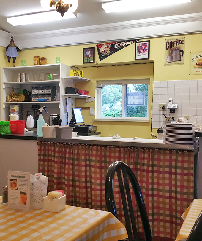 The counter area showcases Valley Café's unpretentious charm – where coffee flows freely and regulars are greeted by name.