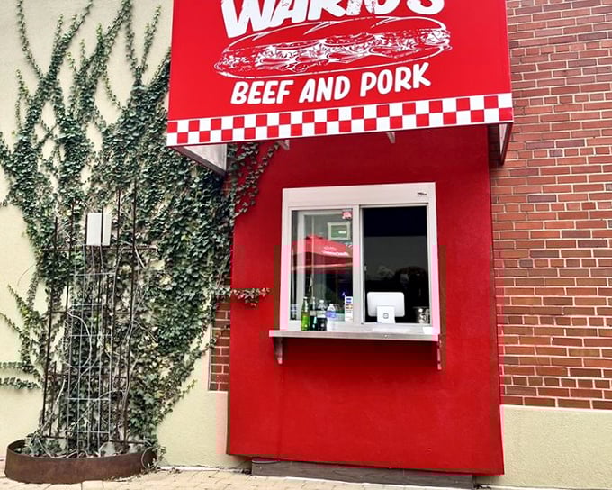 The order window, framed by climbing ivy, feels like something from a storybook—if that storybook was about finding sandwich nirvana.
