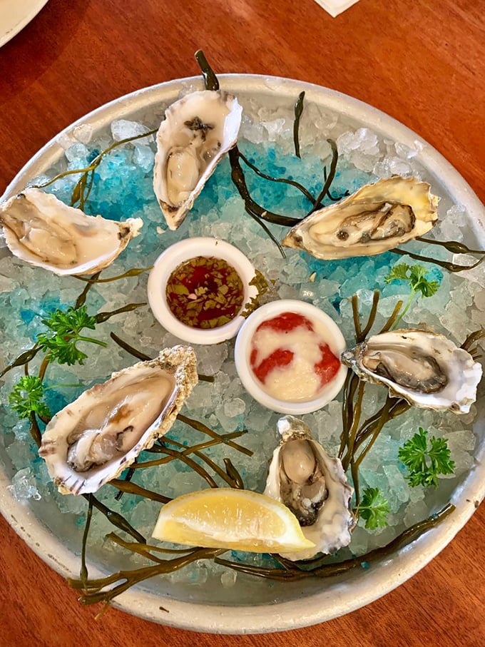 Oysters arranged like jewelry on ice—briny treasures from the deep that need nothing more than a squeeze of lemon and appreciative company.
