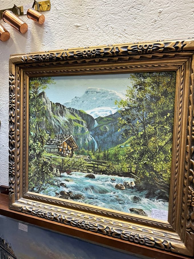 Mountain landscapes in ornate frames—the kind of painting that hung in your grandparents' living room, now considered retro chic.