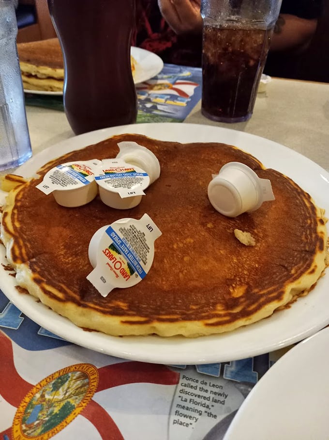 This pancake isn't just large—it's the size that makes other pancakes feel inadequate, with a perfect golden hue that screams "weekend morning bliss."