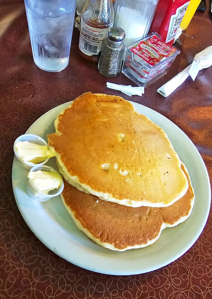 These pancakes aren't just breakfast – they're golden discs of possibility, waiting for butter to perform its melting magic.