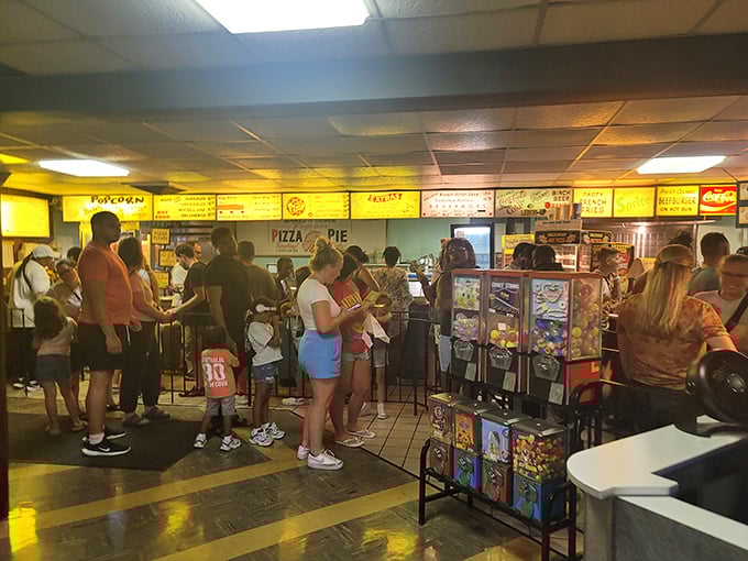 The intermission dash—that beautiful chaos of moviegoers racing to secure snacks before the feature presentation resumes.