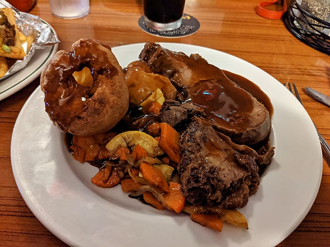Sunday roast that would make your British grandmother weep with joy—tender meat, Yorkshire pudding, and gravy worth bottling.
