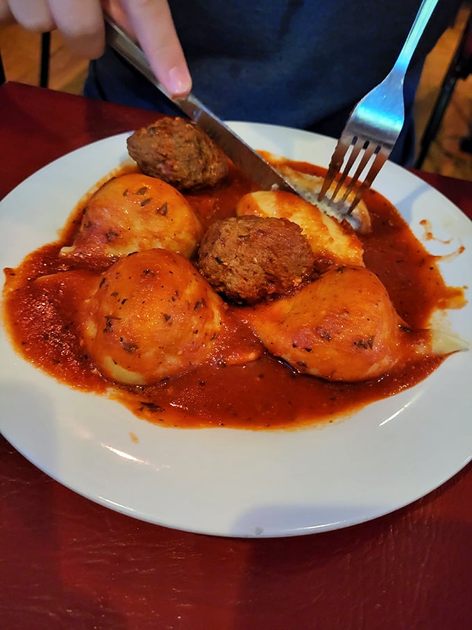 Ravioli and meatballs bathed in rich tomato sauce—the kind of dish that makes conversation stop and eyes close in appreciation with the first bite.