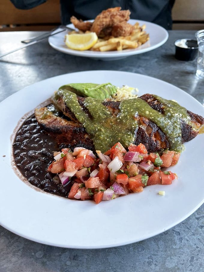 This isn't just lunch; it's a Mexican-inspired seafood fiesta where black beans, salsa, and grilled fish perform a perfectly choreographed flavor dance.