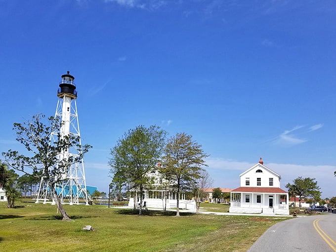 Drive past the relocated lighthouse complex where history stands preserved against the brilliant blue Florida sky, no admission ticket required.