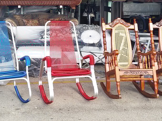Rocking chairs lined up like eager dancers at a sock hop, each with its own personality and promise of porch-sitting perfection.