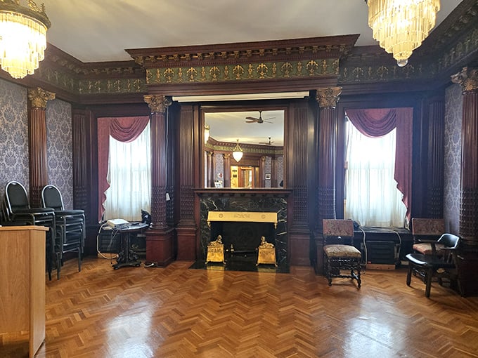 Rich wood paneling and period furniture transform this room into a time capsule where you half-expect a butler to appear with afternoon tea.