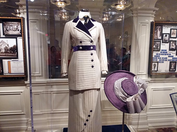More than just a costume—this striking white and purple ensemble represents the height of 1912 fashion and the social status of its wearer.