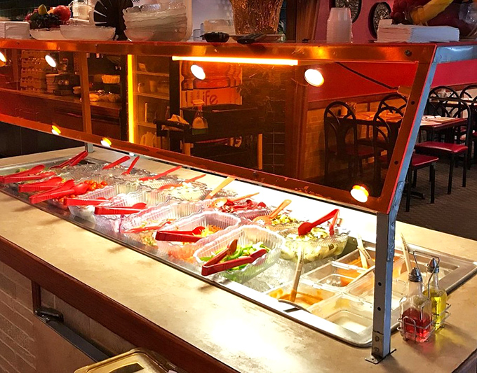 The salad bar – where health-conscious intentions go to negotiate with your appetite. Those vibrant colors are nature's way of saying "eat me."