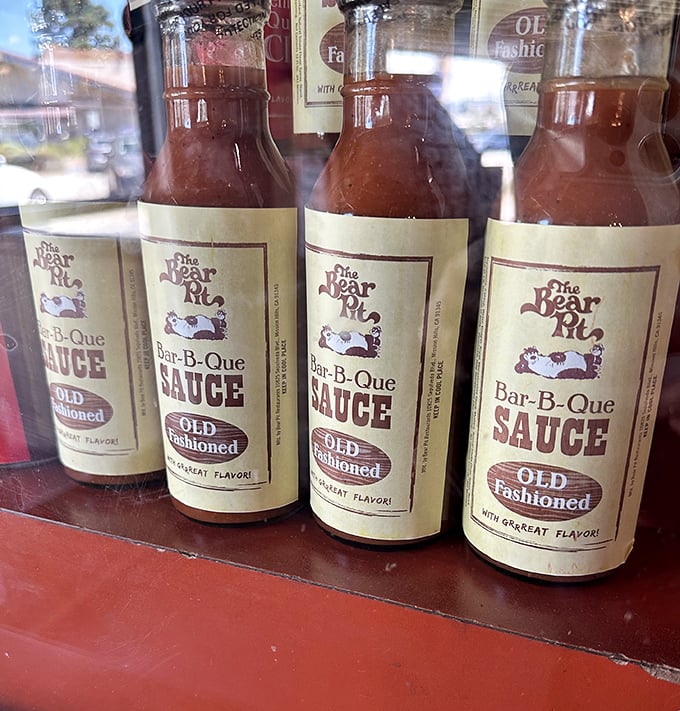 Their signature sauce bottles lined up like trophies. That "Old Fashioned" label isn't just branding—it's a philosophy that's kept customers coming back since before Instagram existed.