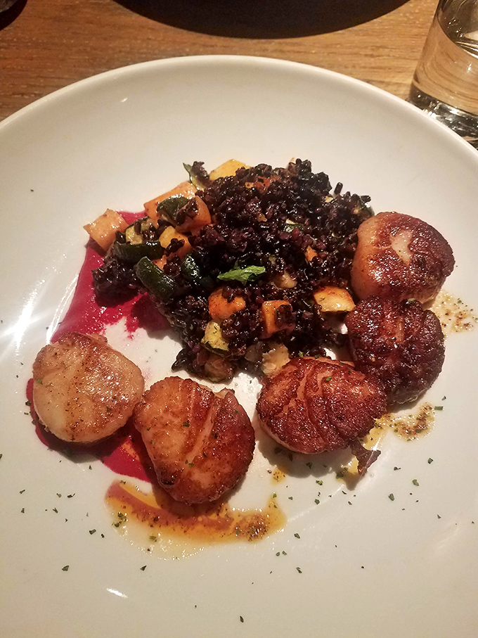 These perfectly seared scallops rest on a bed of dark greens—ocean meeting garden in a dish that's both elegant and soul-satisfying.